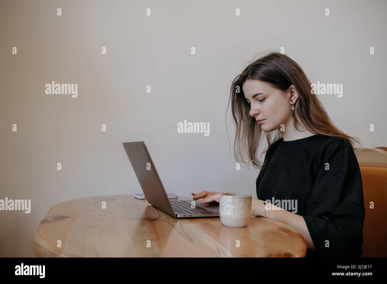 freelance woman happy working in a cafe remotely Stock Photo - Alamy