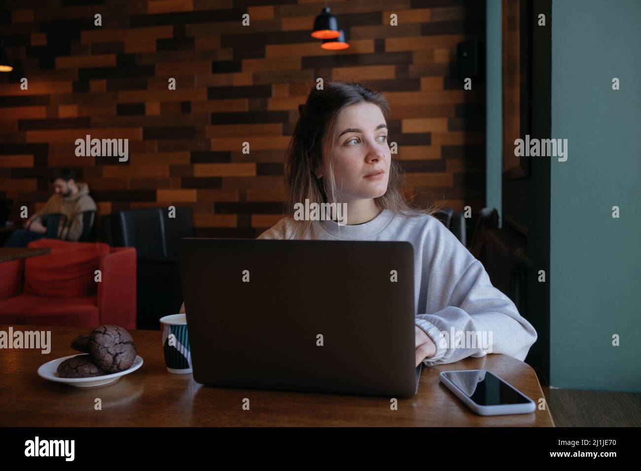 freelance woman happy working in a cafe remotely Stock Photo - Alamy
