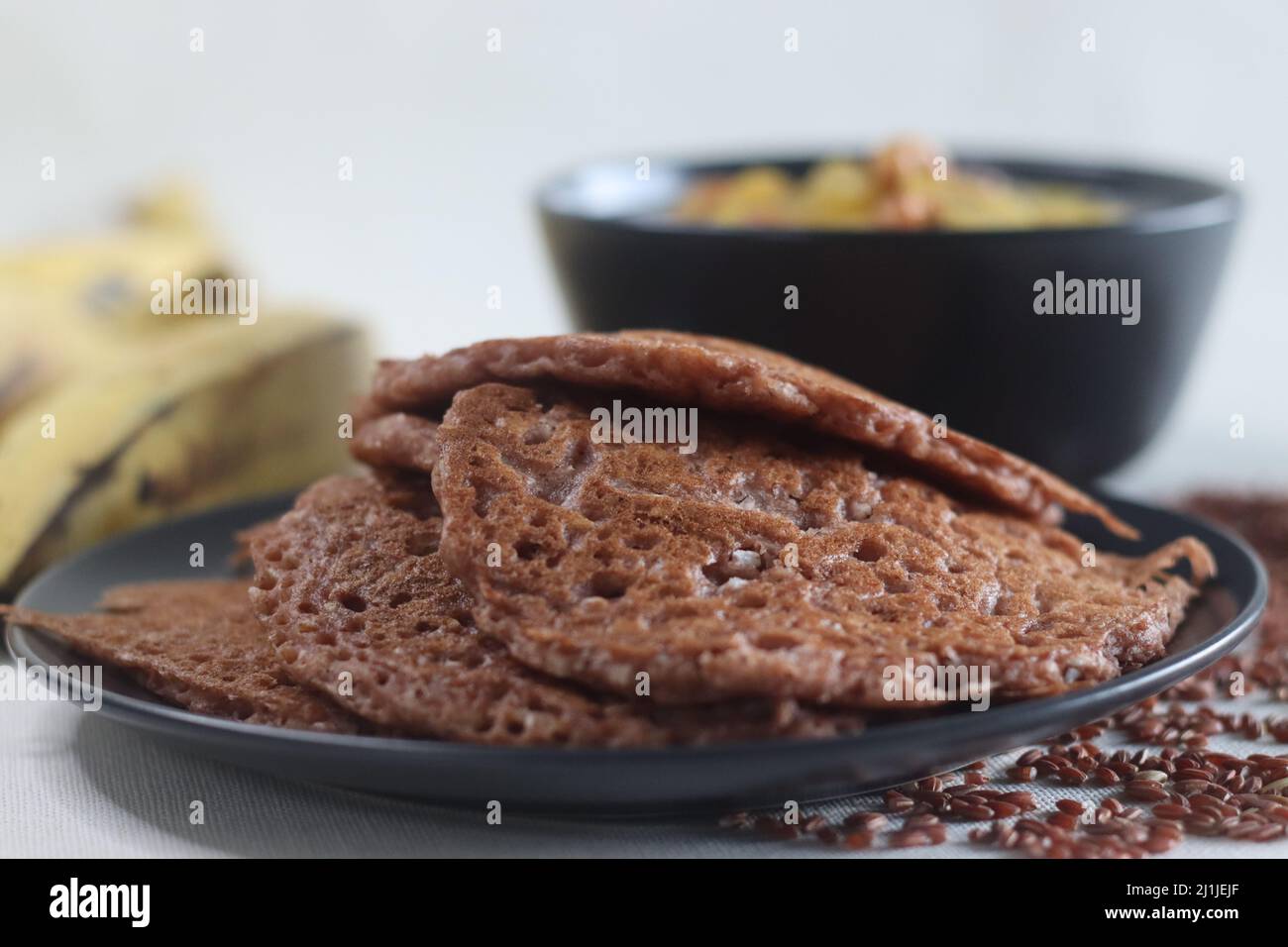 Red rice pancakes. Pancakes made of a fermented batter of red rice and ...