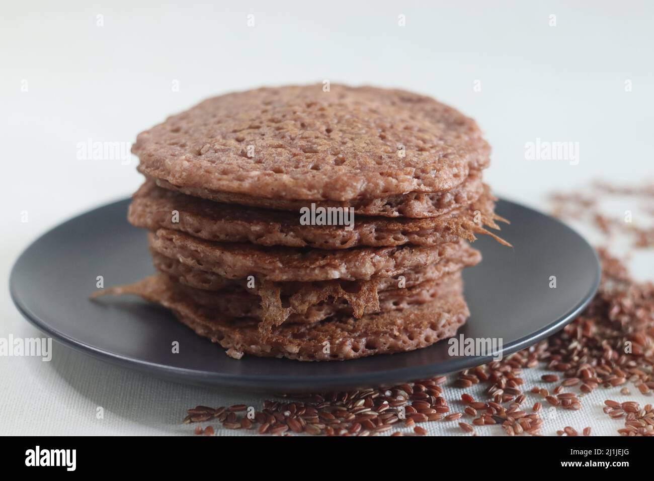 Red rice pancakes. Pancakes made of a fermented batter of red rice and ...