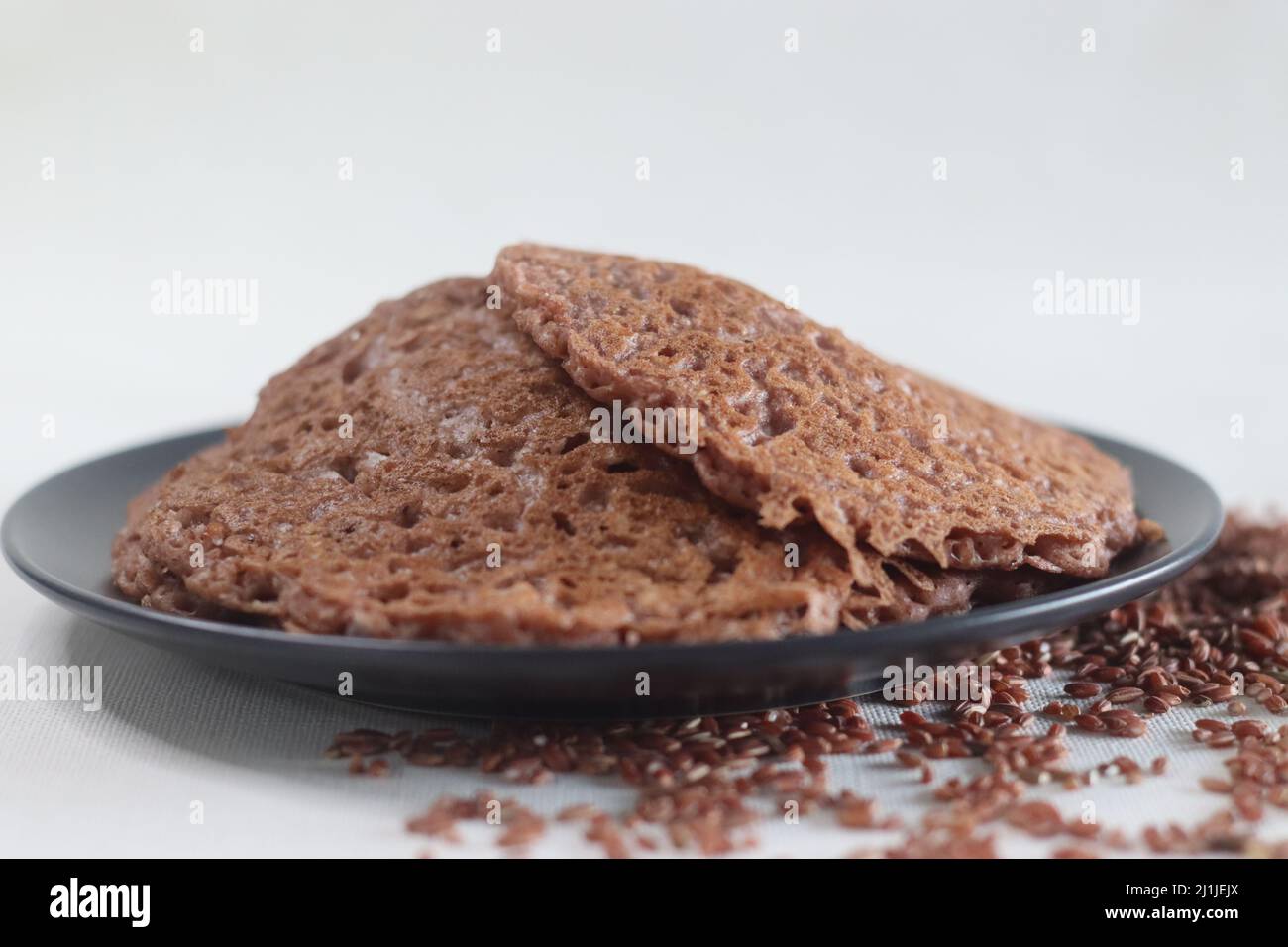 Red rice pancakes. Pancakes made of a fermented batter of red rice and ...