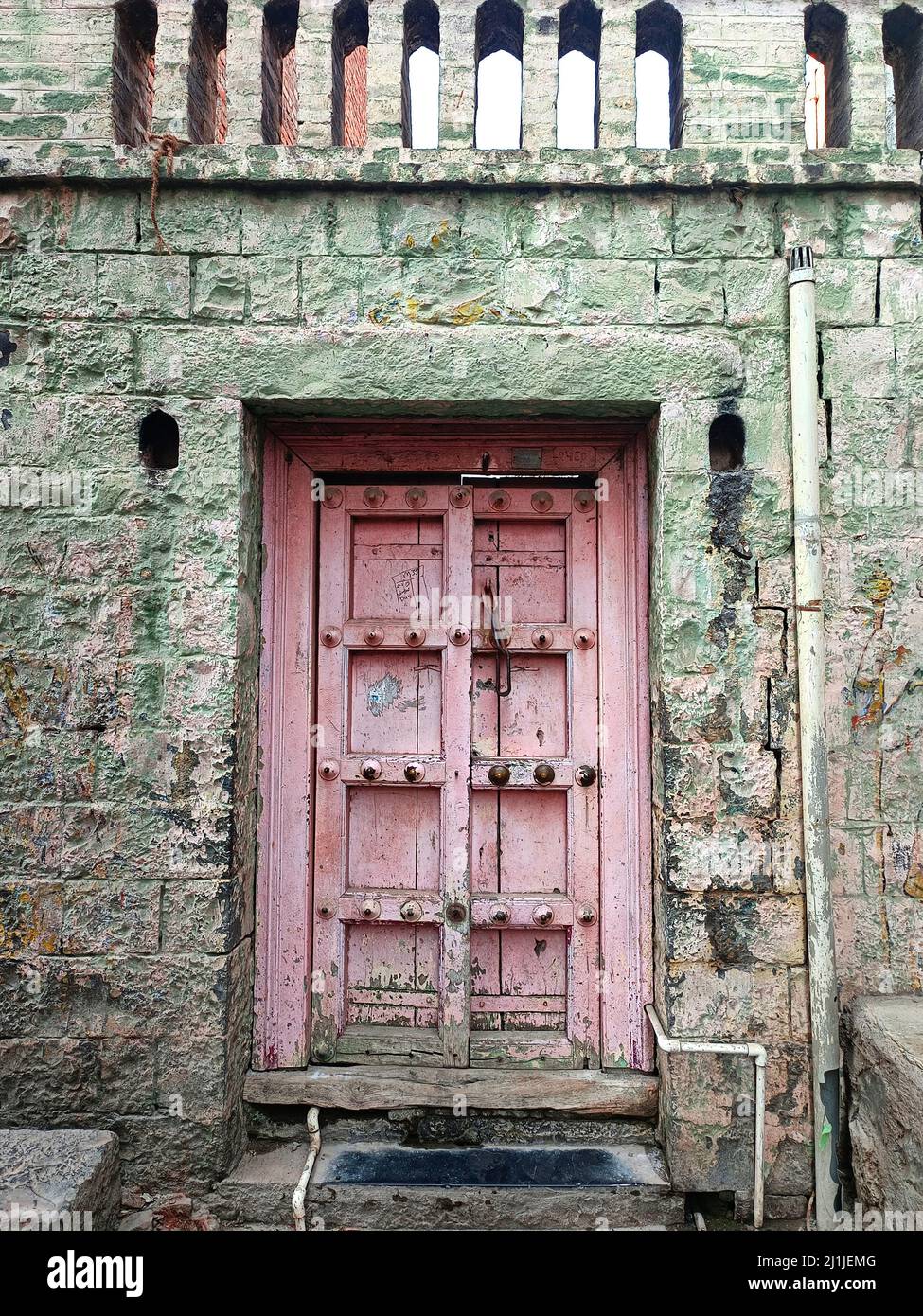 21 March 2022, Pandharpur, India, Old Vintage wooden door on retro wall ...