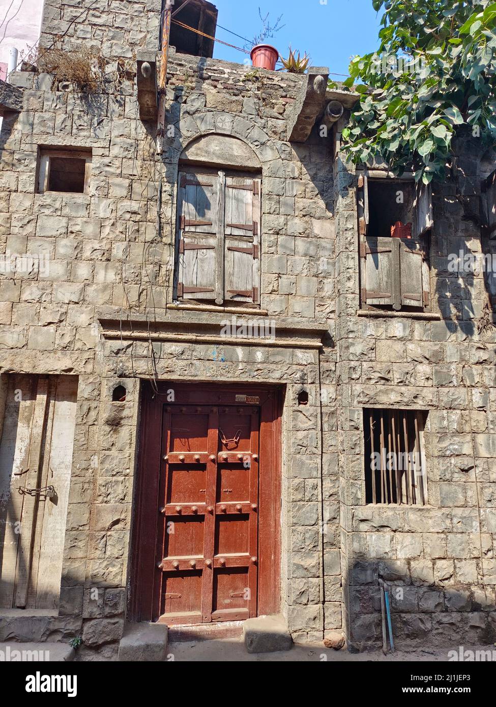 21 March 2022, Pandharpur, India, Old Vintage wooden door on retro wall ...