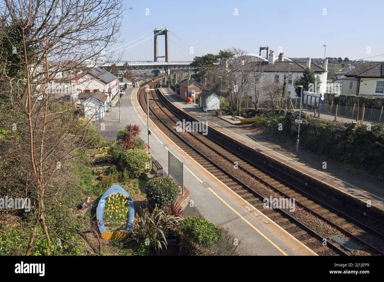 Saltash Railway Station with the Tamar Road Bridge in the distance ...