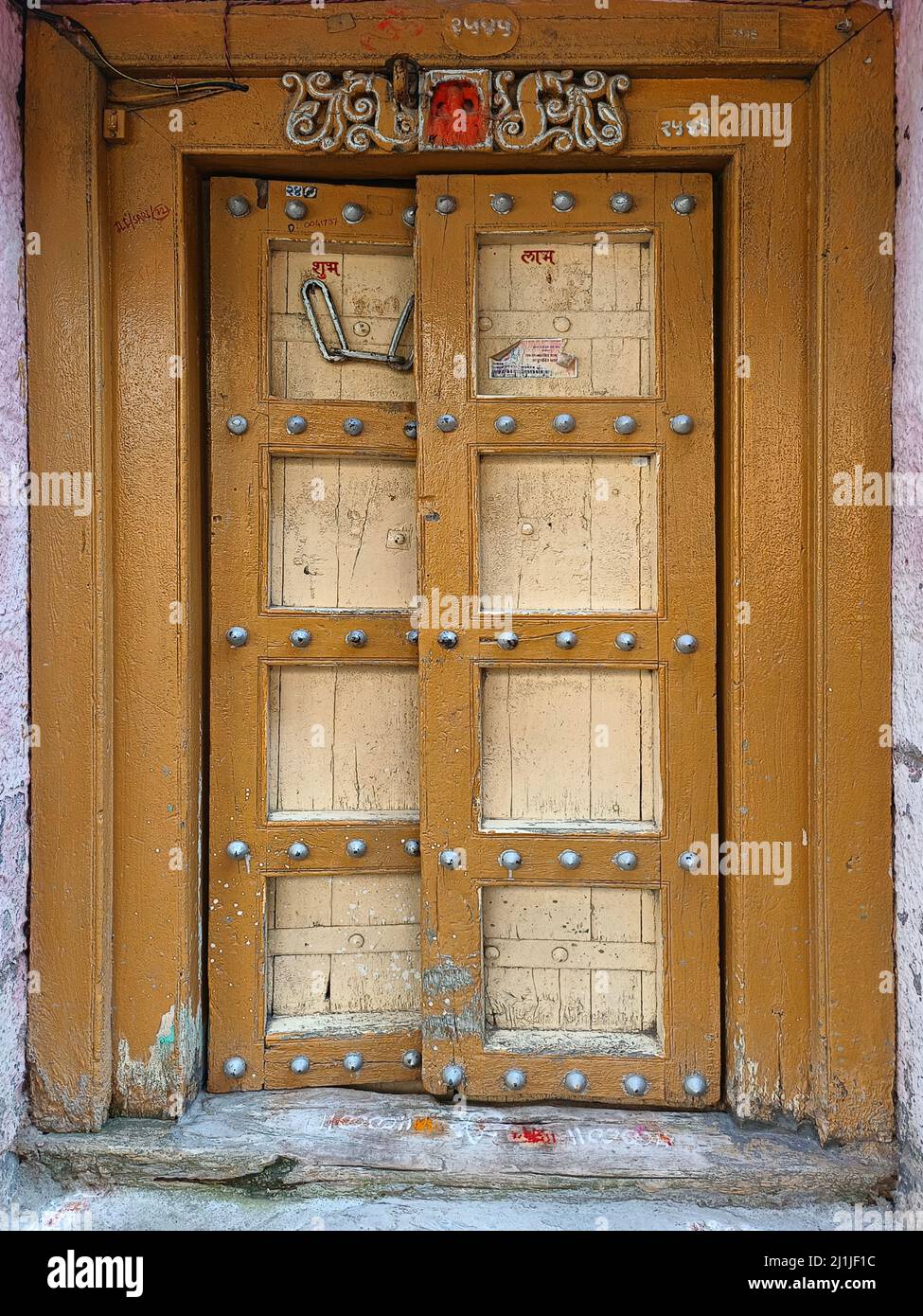 21 March 2022, Pandharpur, India, Old Vintage wooden door on retro wall ...