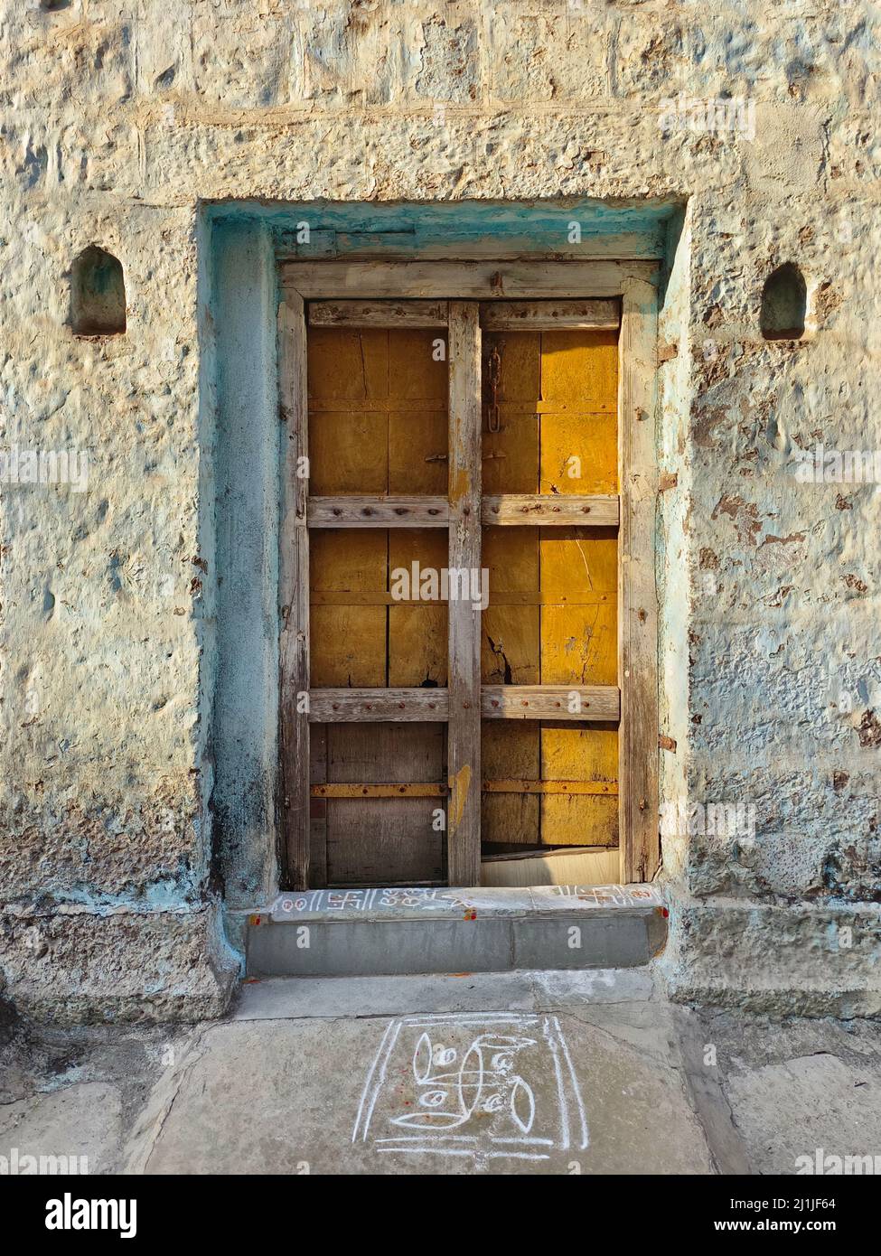 21 March 2022, Pandharpur, India, Old Vintage wooden door on retro wall ...