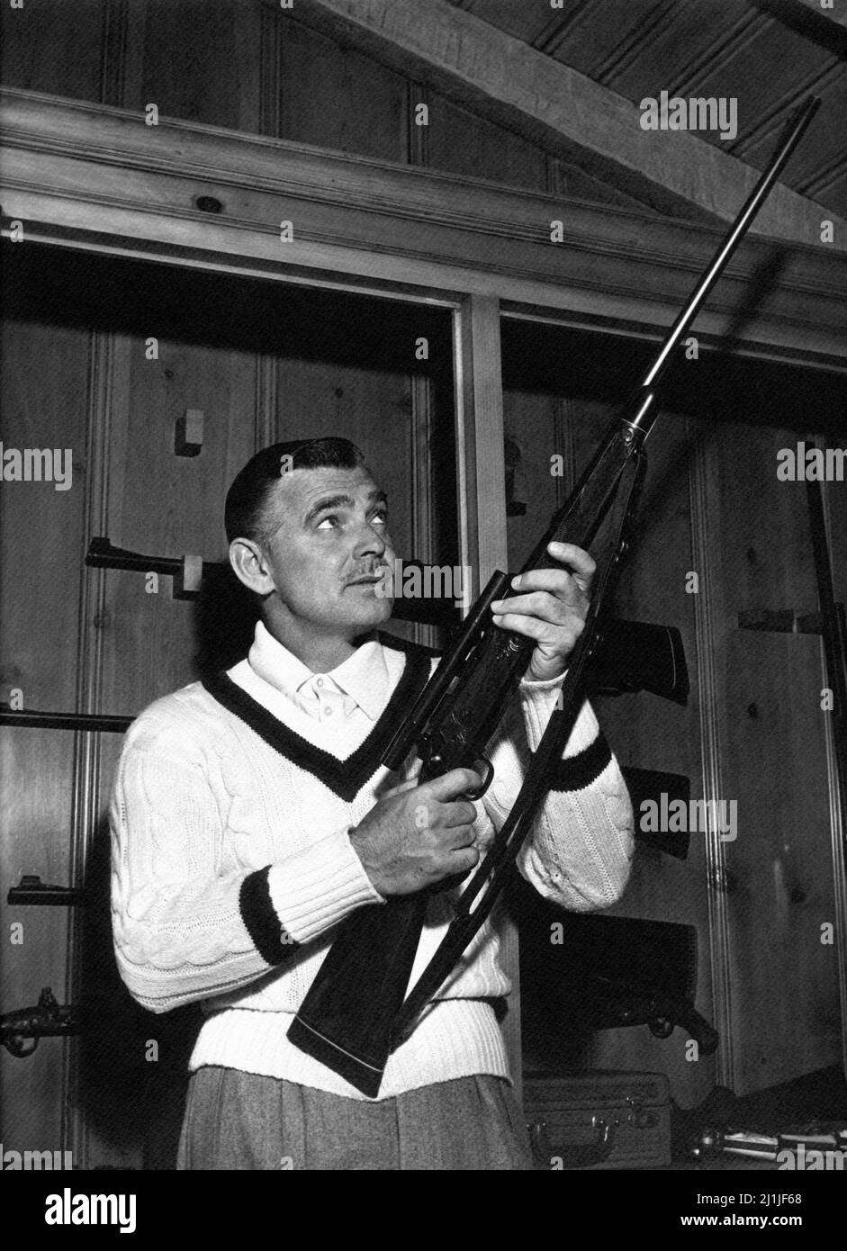 CLARK GABLE showing his Gun Collection at his Ranch Home in Encino ...
