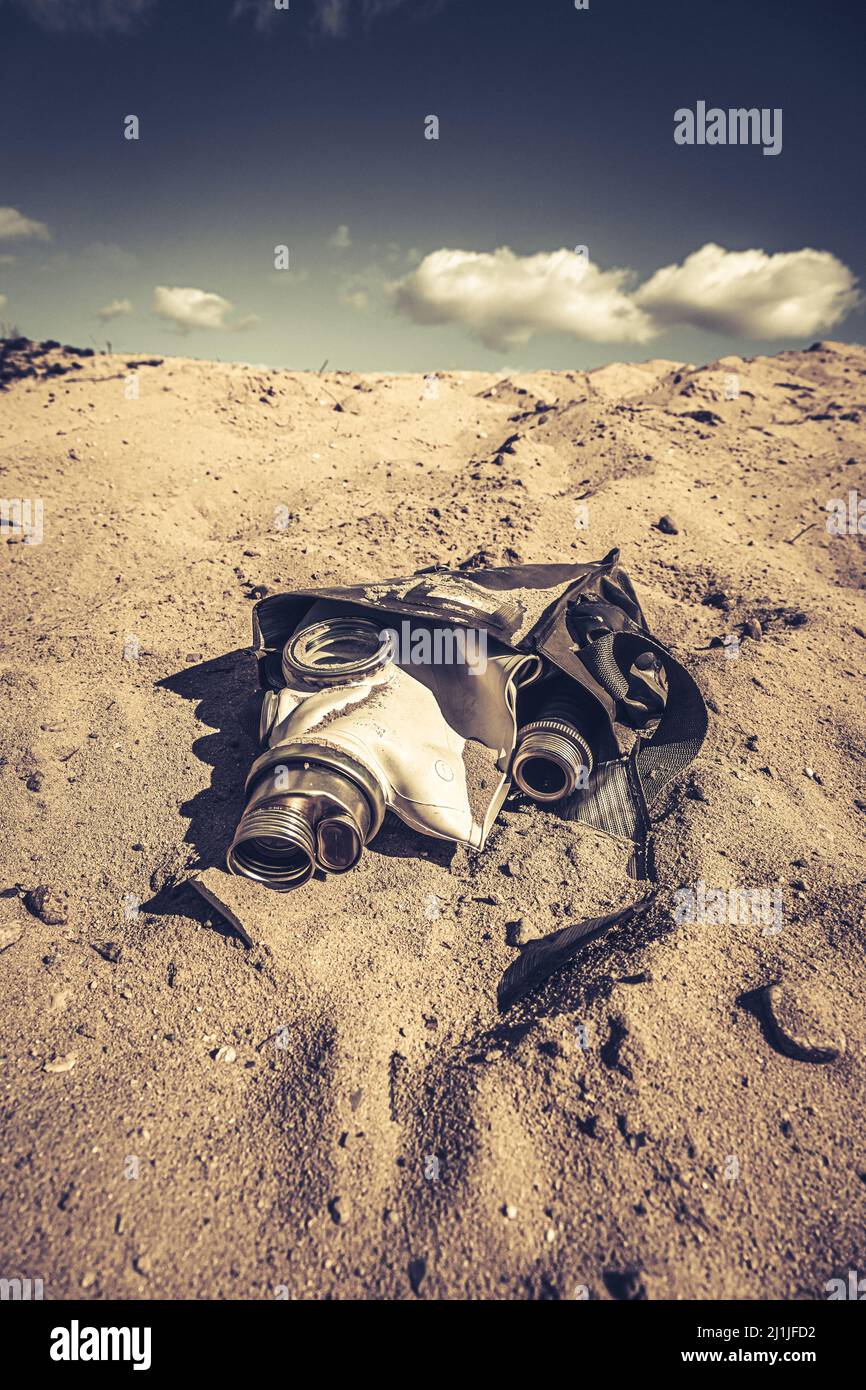 Contaminated gas mask in deadly polluted area. Destroyed gas mask in a ...