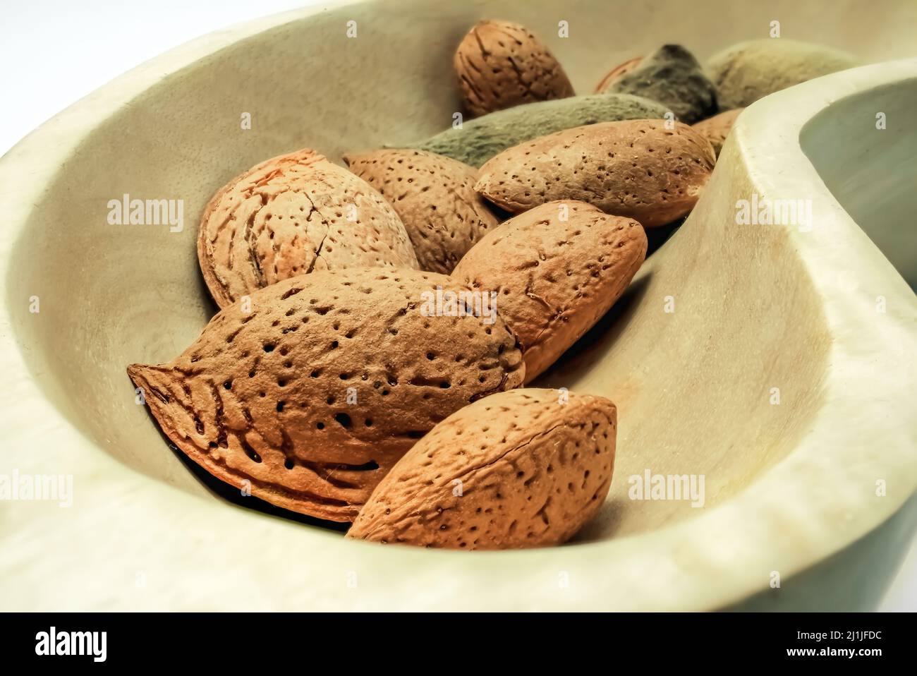 Natural split almonds in the foreground Stock Photo - Alamy
