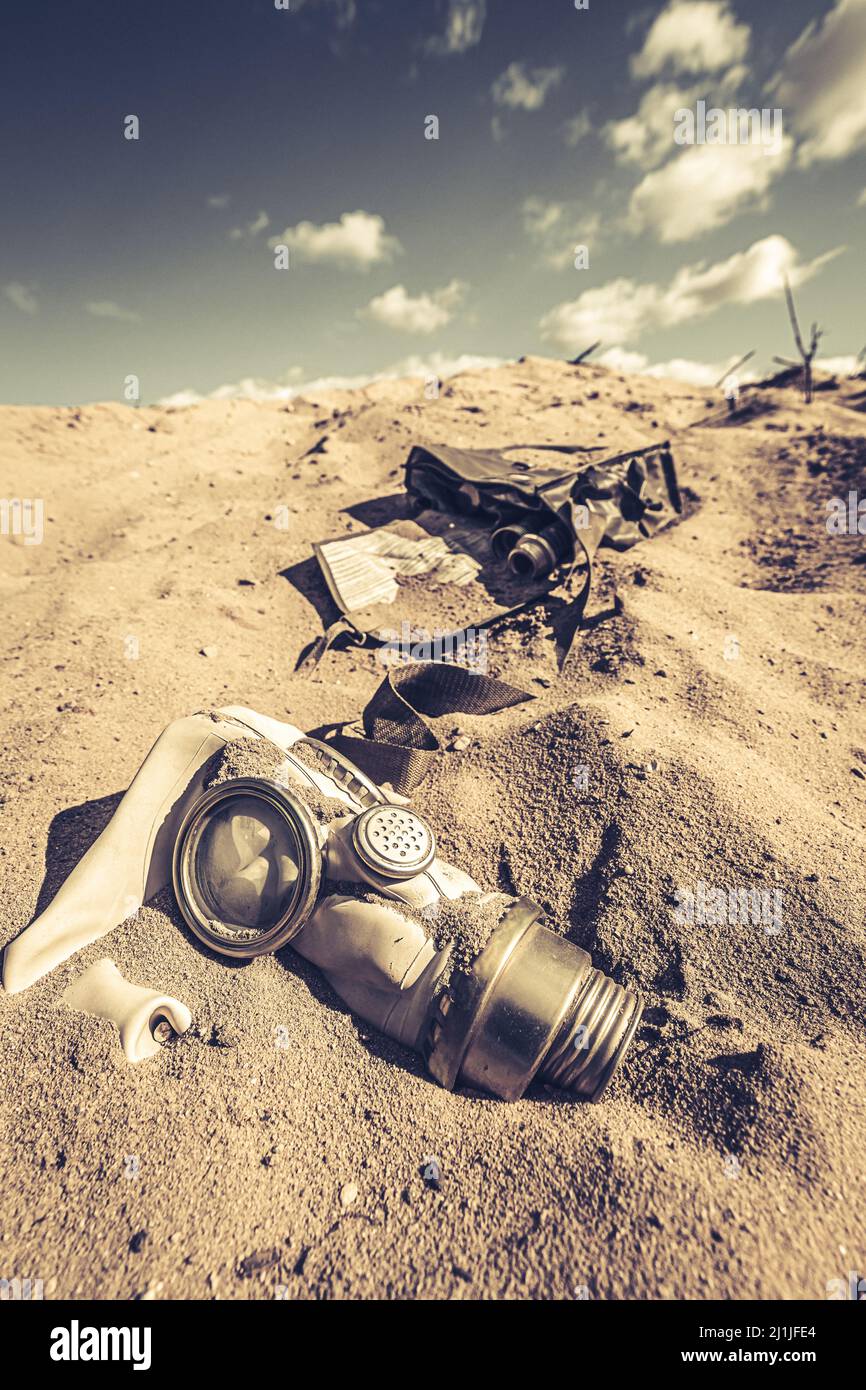 Damaged gas mask in danger and toxic desert. Destroyed gas mask in a ...