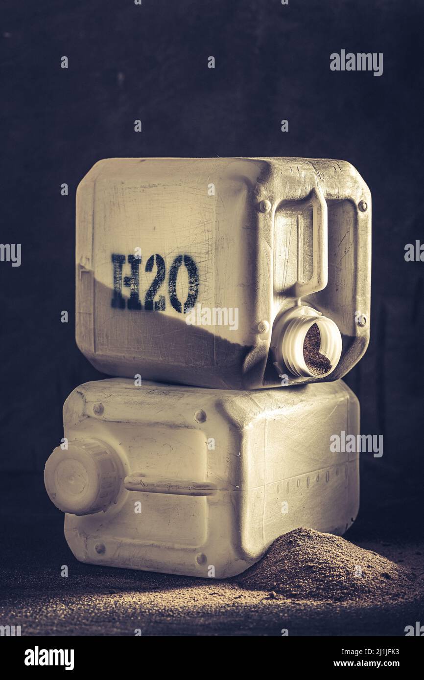 Contaminated water cans as problem of climate change on earth. Empty ...