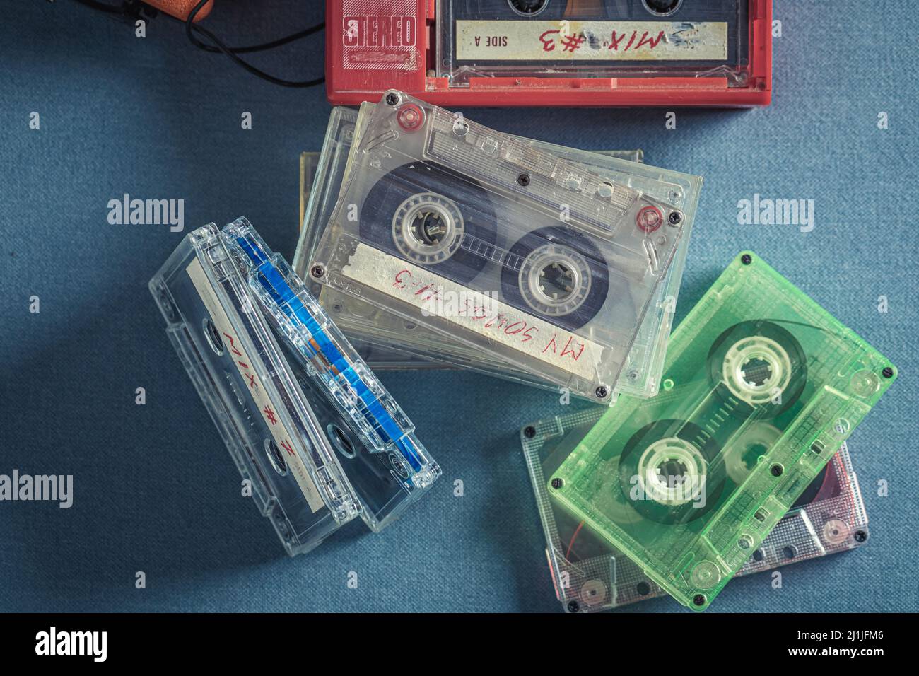 Classic cassette tape with red player and headphones. Cassette audio ...