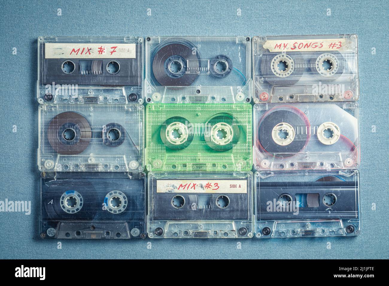Old transparent cassette tapes arranged in a grid on blue sofa Stock ...