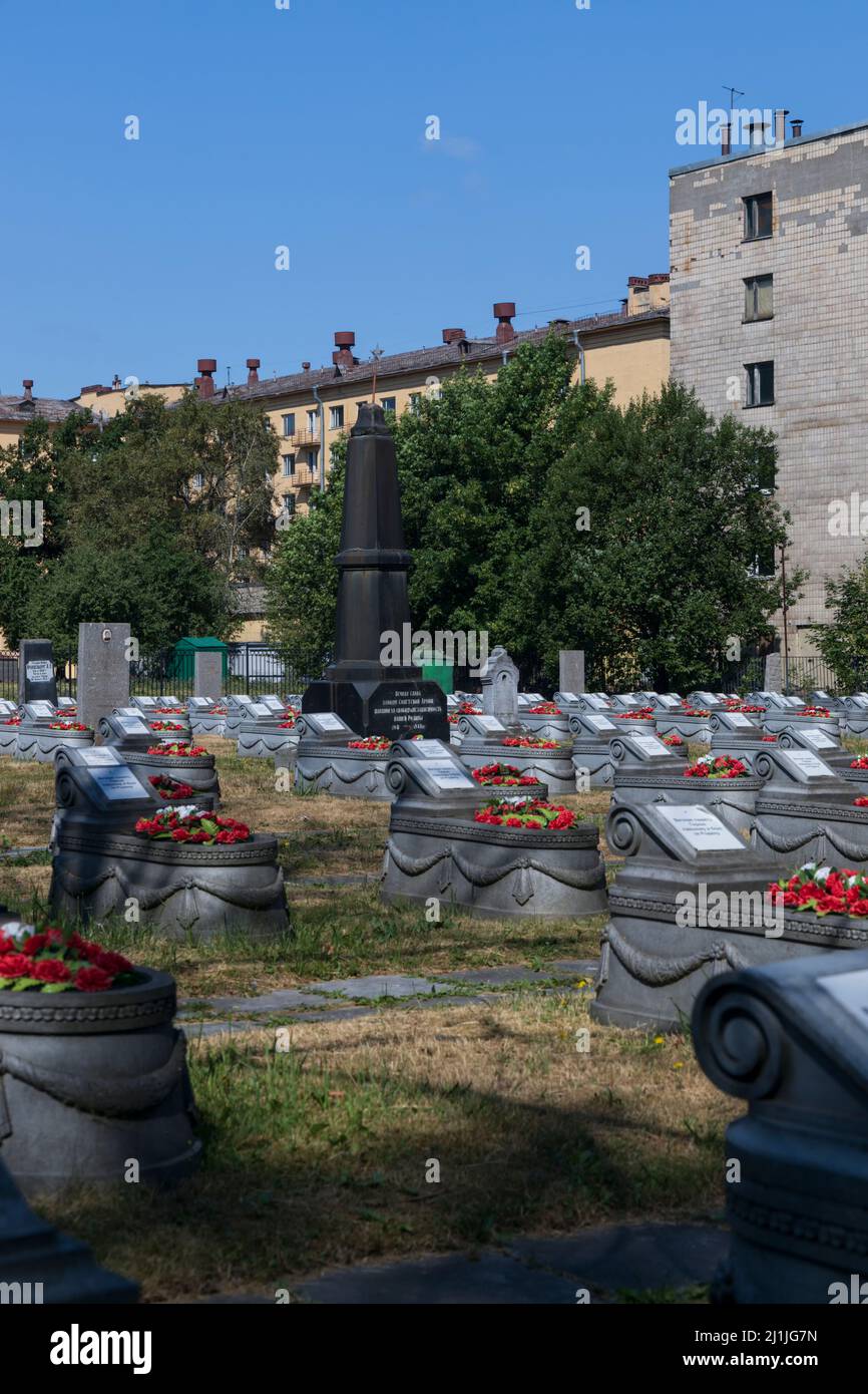 Saint Petersburg, Russia - July 18, 2021: Black obelisk and graves at ...