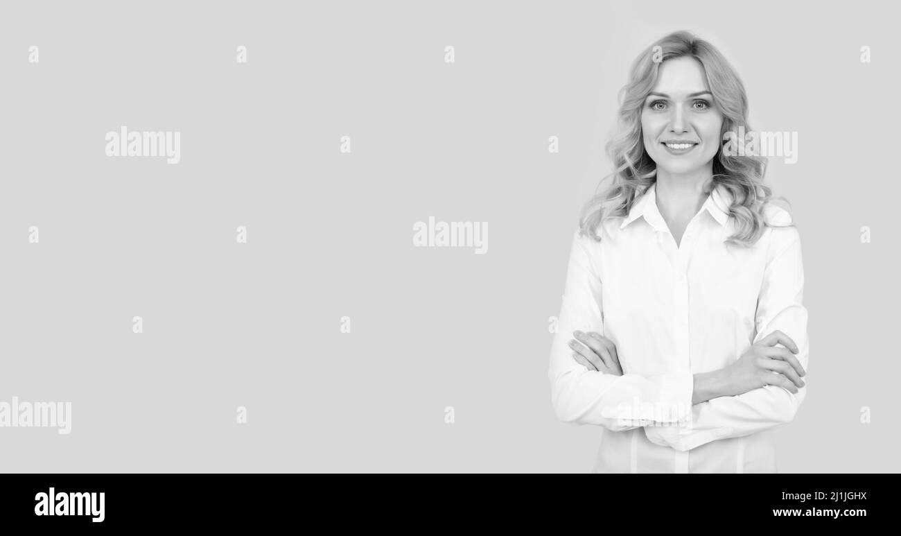 cheerful blonde woman in white shirt. office worker. corporate fashion Stock Photo - Alamy