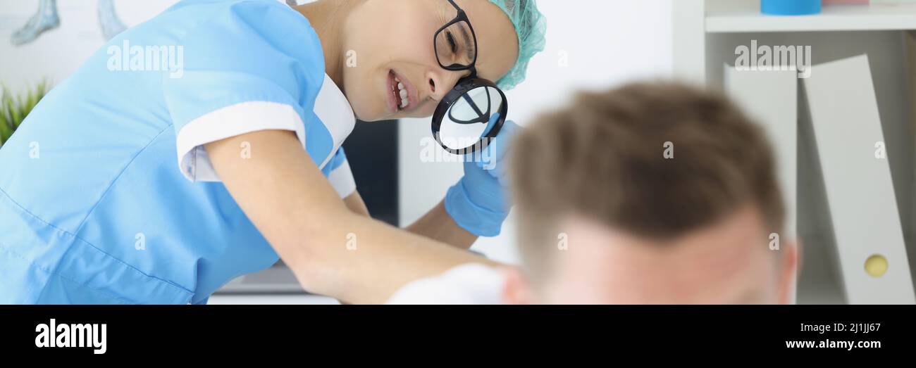 Female doctor looking at the body of a male patient Stock Photo - Alamy