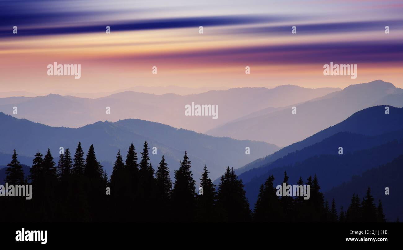 Landscape with mountains under morning sky with clouds Stock Photo - Alamy