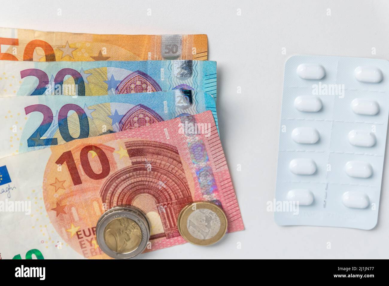 Expensive medical treatment represented by euro money and euro bank ...