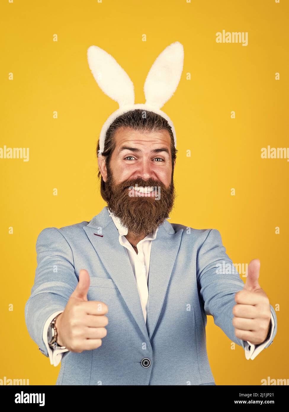 symbol of perfection. funny bearded hipster in bunny ears. celebration ...