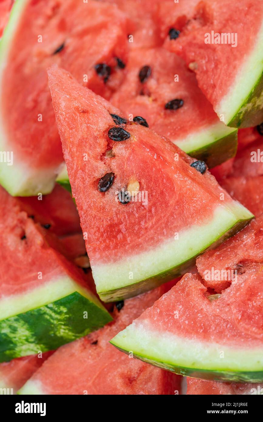 watermelon, fresh and ripe watermelon slices as a background. delicious ...