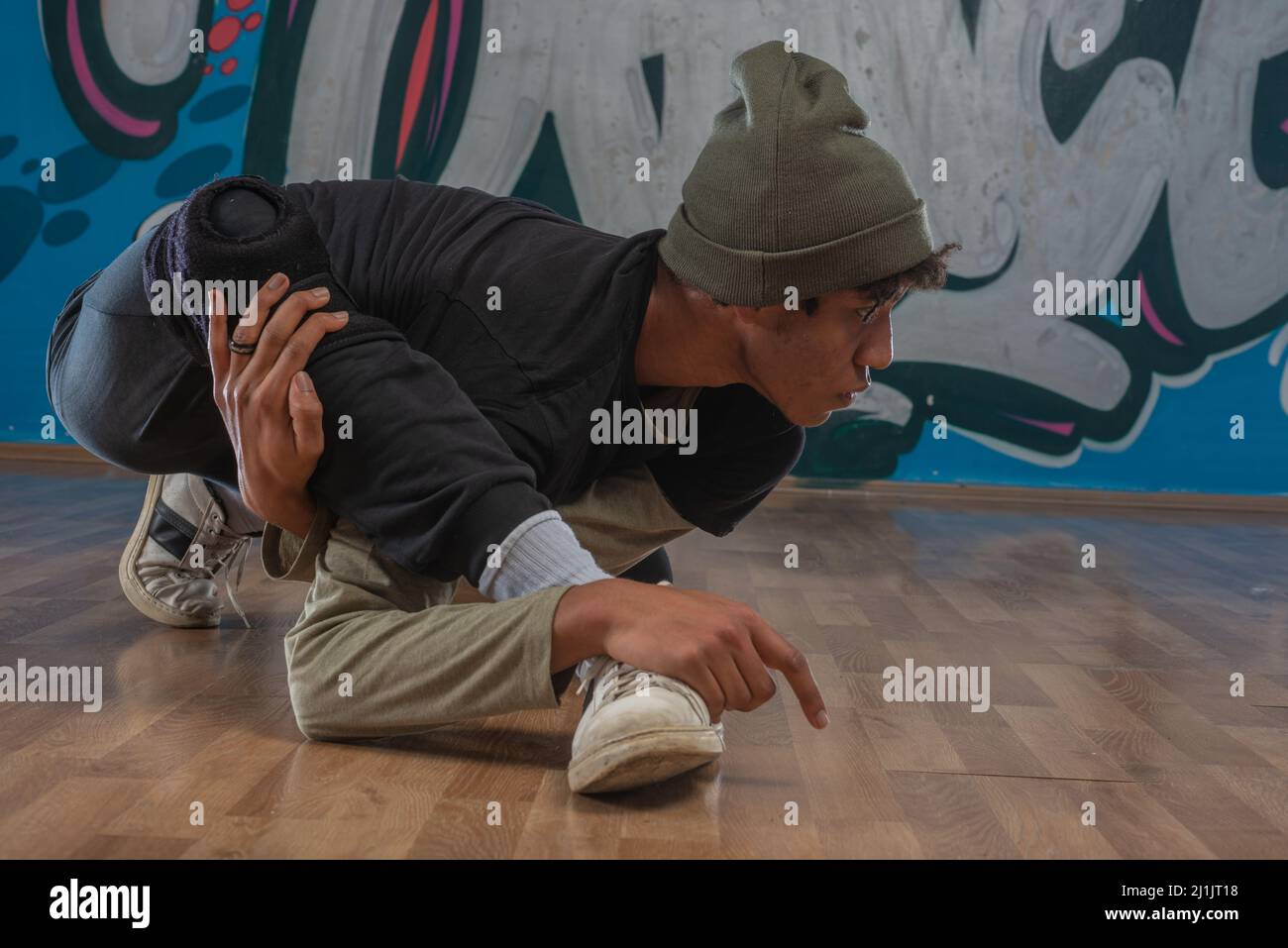 Modern rapper dancing in garage. Urban lifestyle, hip hop Stock Photo ...