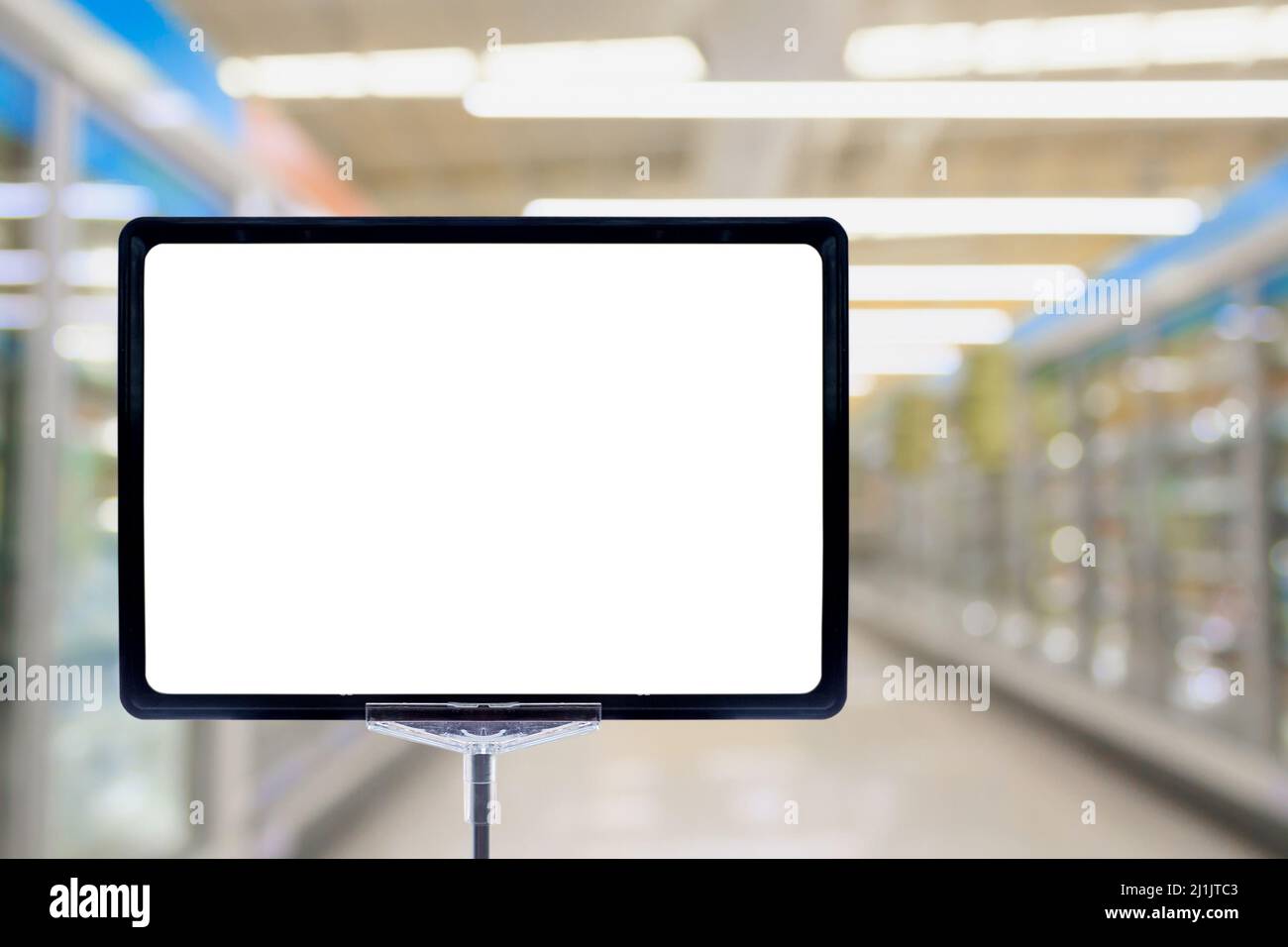 Blank price board over frozen product aisle in supermarket Stock Photo ...