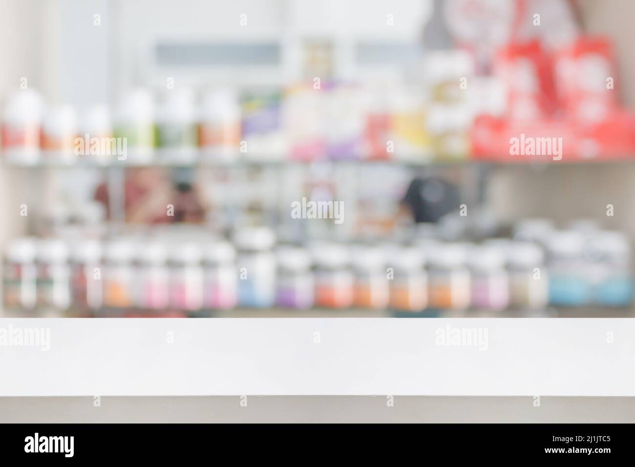 pharmacy store counter table top with blur medicine on shelves in the ...