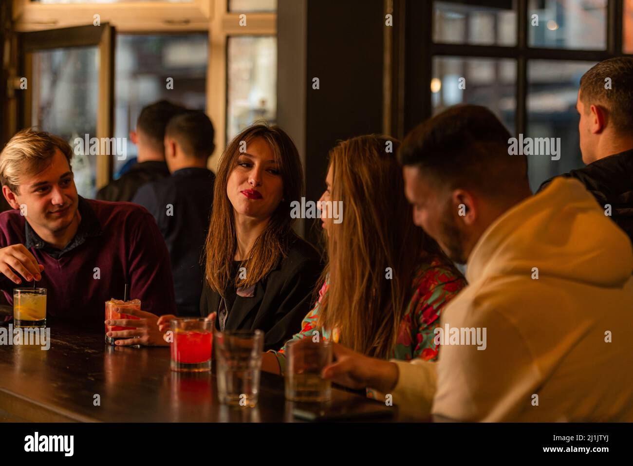 Two amazing and beautiful couples are talking with each other Stock ...