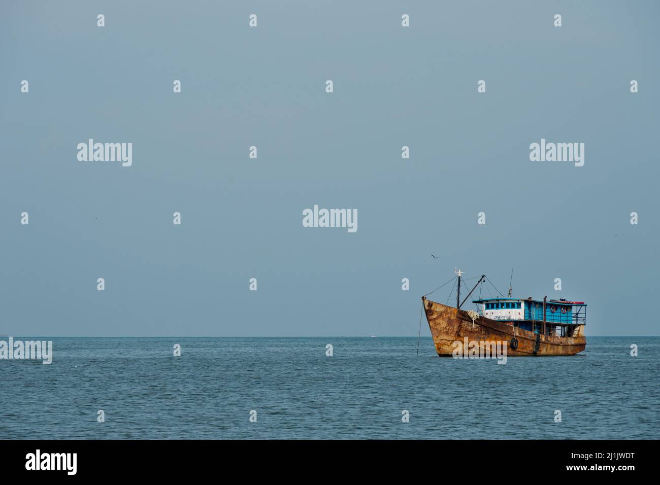 a photo of old rusty boat in the harbor in Panama City, Panama Stock ...