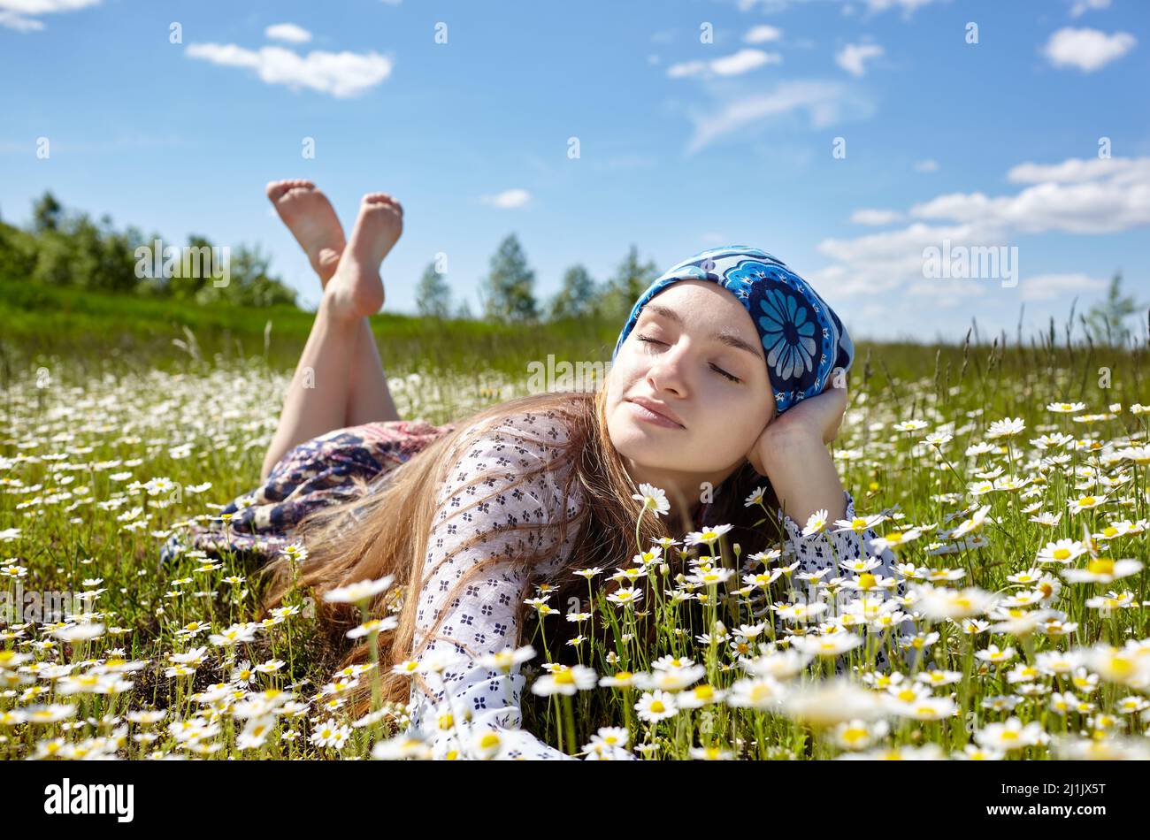 Woman lying in the sun hi-res stock photography and images - Alamy