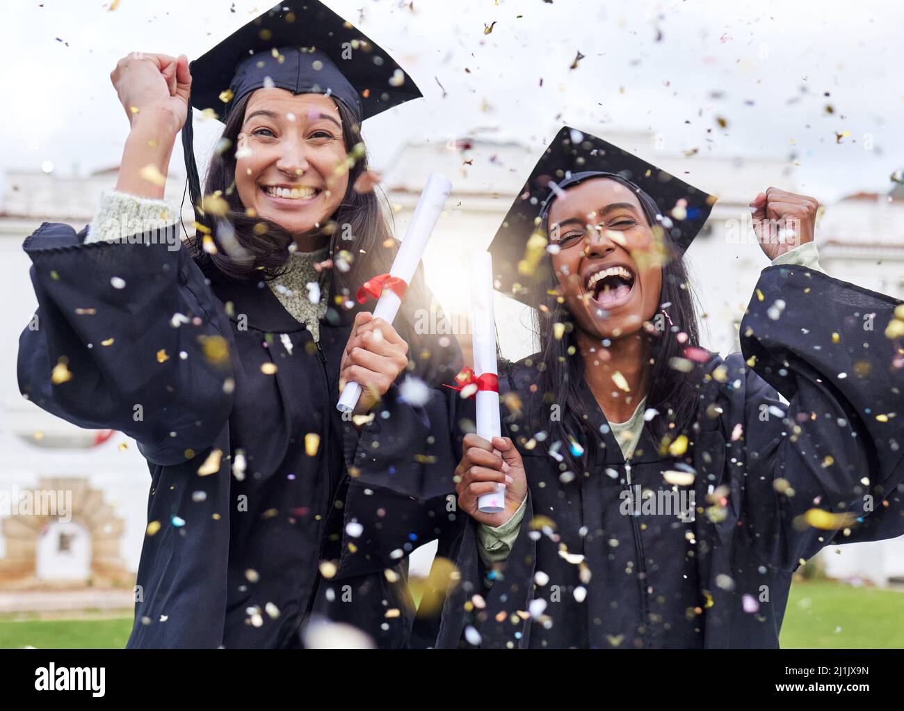 Queue the celebrations. Cropped portrait of two attractive young female ...