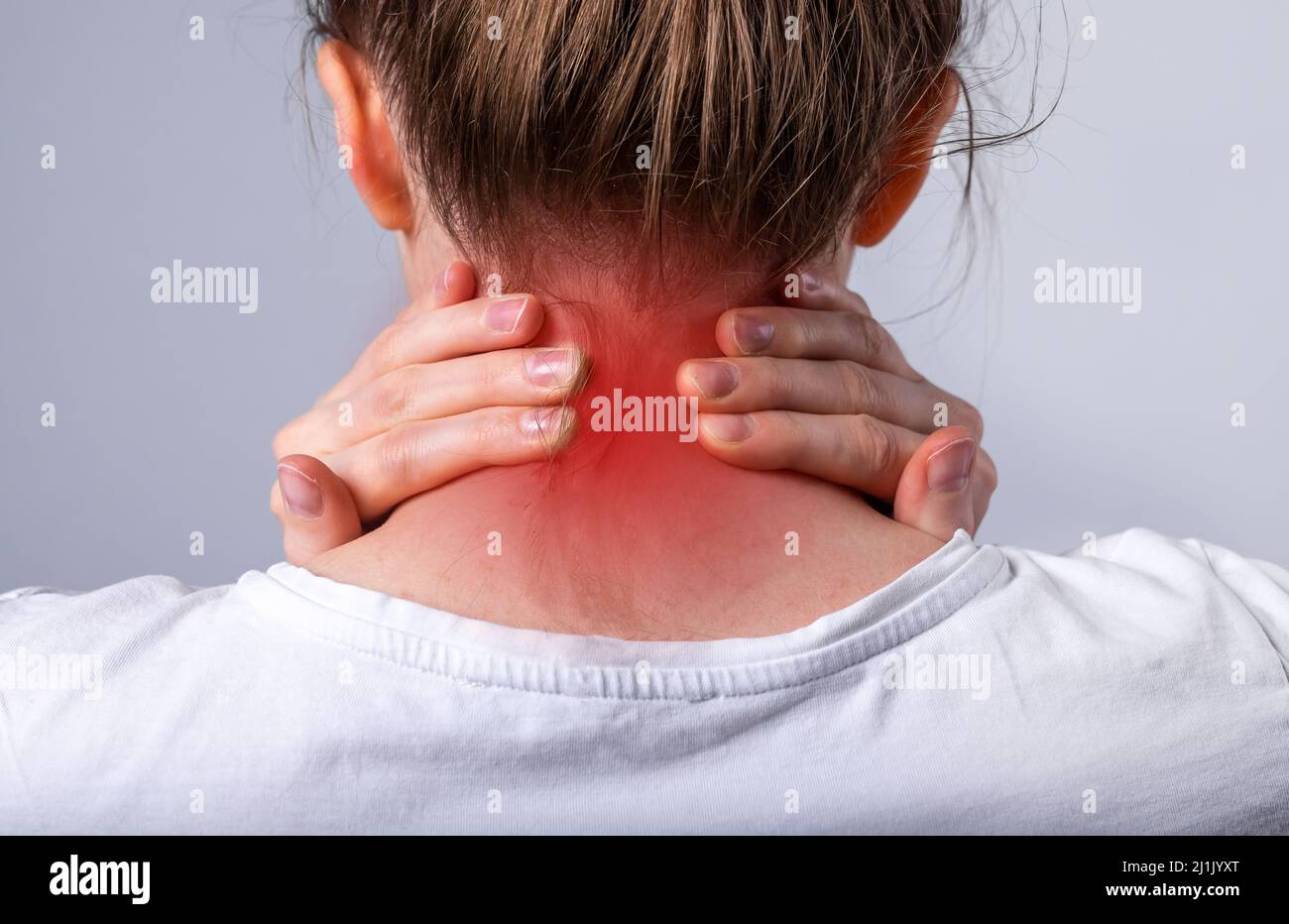 Nape pain closeup. Ache in back neck. Person suffering from injury ...
