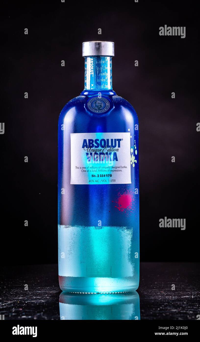 A vertical shot of a glass bottle of an absolute vodka on a black background Stock Photo - Alamy