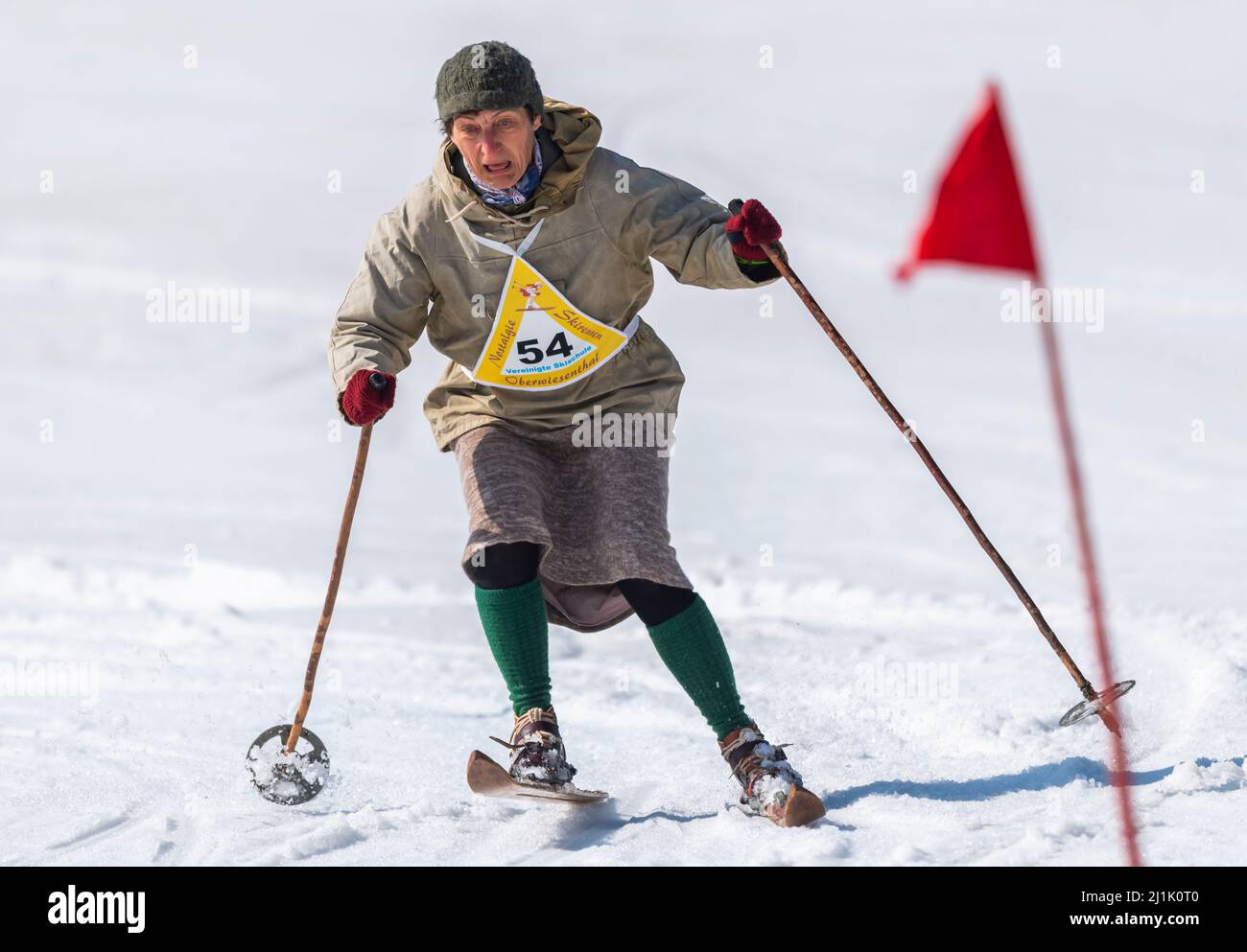 Oberwiesenthal, Germany. 26th Mar, 2022. A participant skis over the ...
