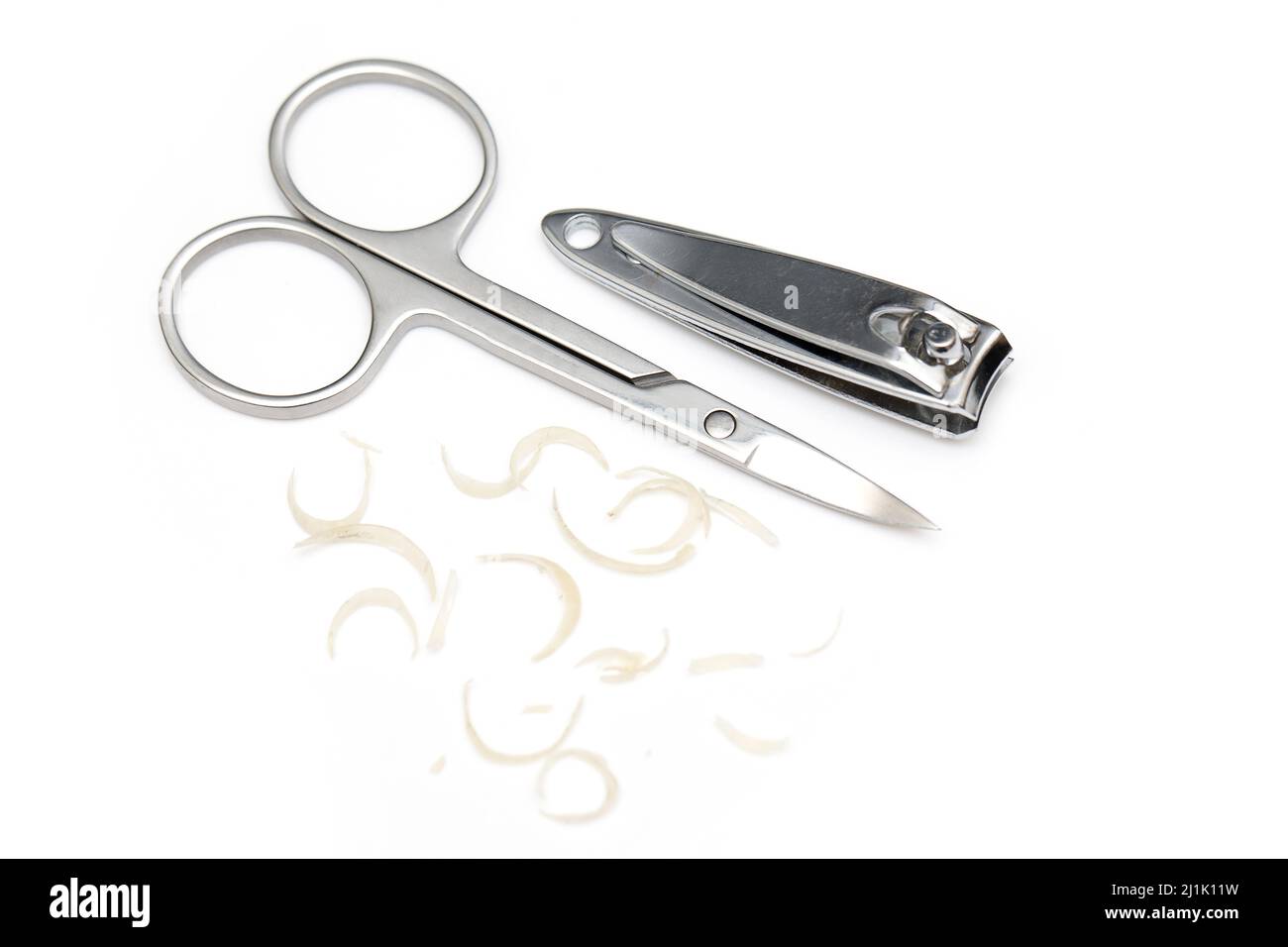 Manicure scissors, clipper and dirty nails on white background Stock ...