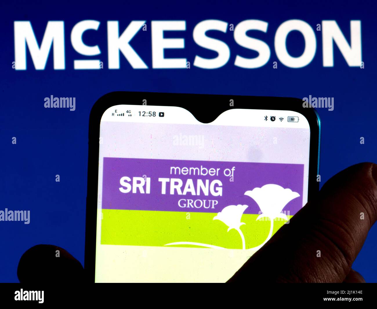 In this photo illustration, the Sri Trang Group is displayed on a ...