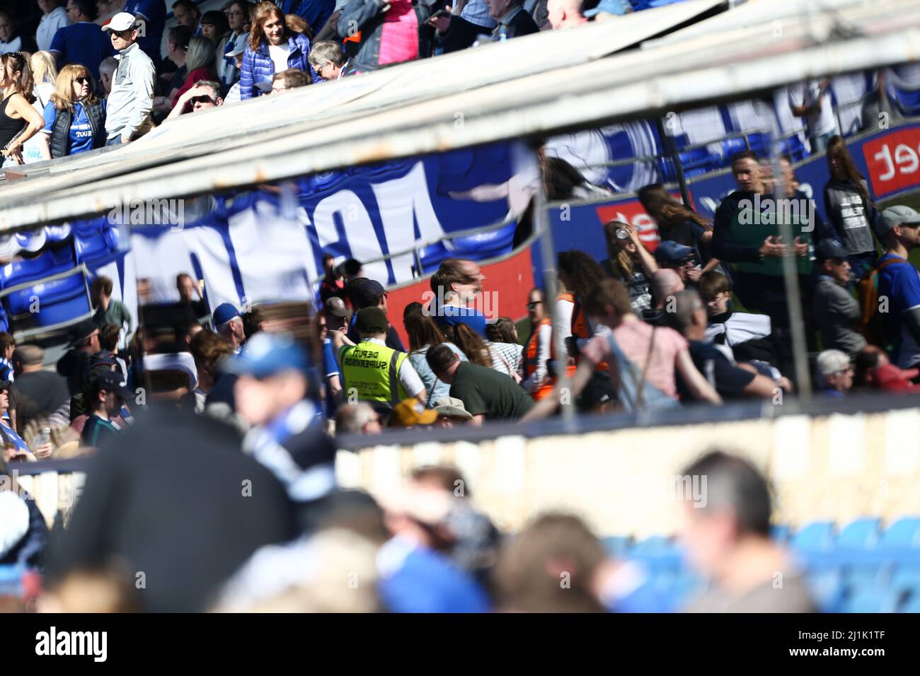 Ipswich Town fans seen in the reflections Stock Photo - Alamy