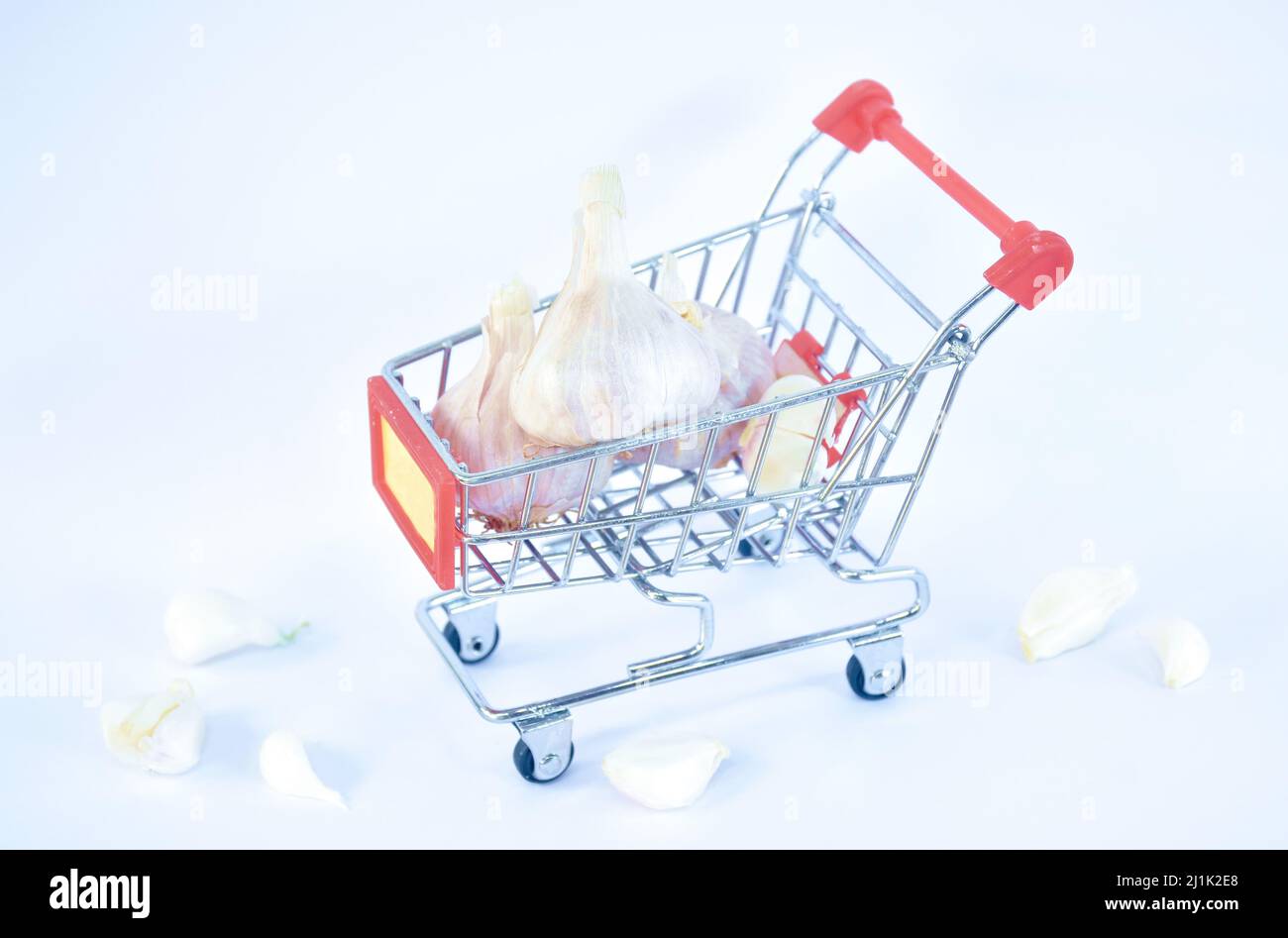fresh garlic carrying on shopping cart in white background Stock Photo ...
