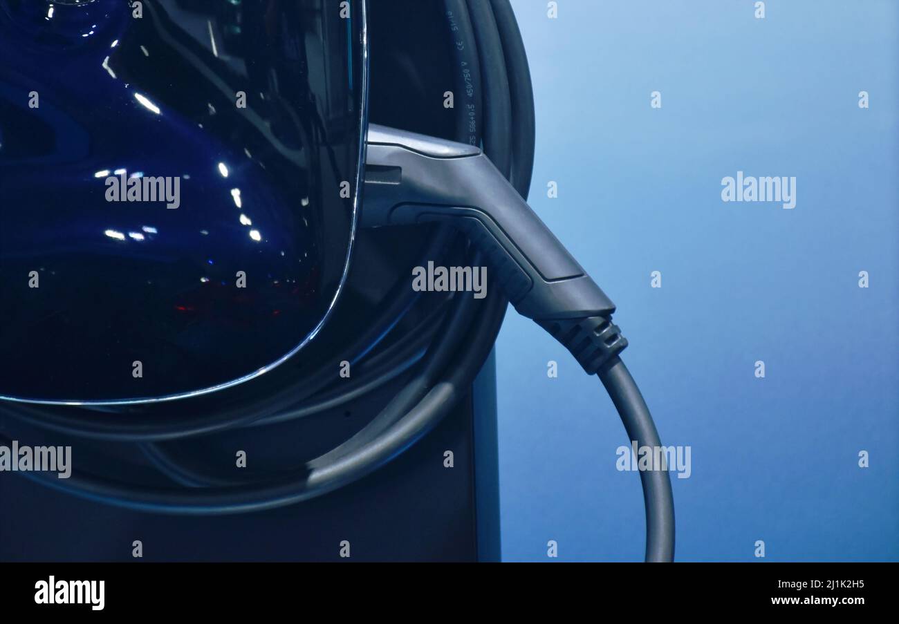 plug in electric vehicle charging to electrical car Stock Photo - Alamy