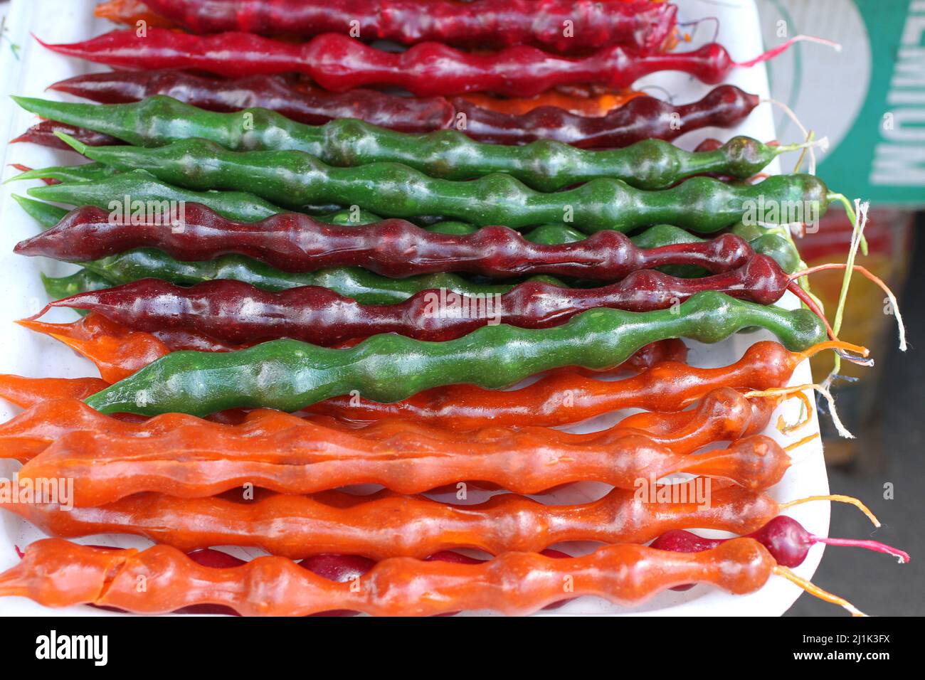 Dessert made from walnuts, doused with fruit juice and dried on strings ...