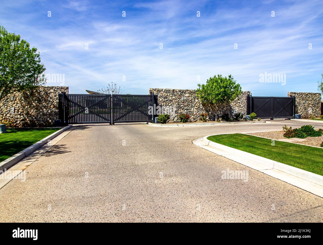 Entry And Exit Gates To Secure Housing Development Stock Photo - Alamy