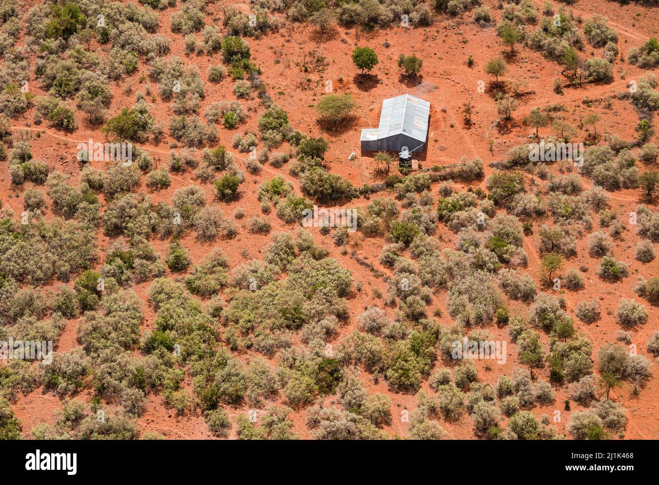 Aerial view of a by fencing enclosed Maasai tribe farm and family ...