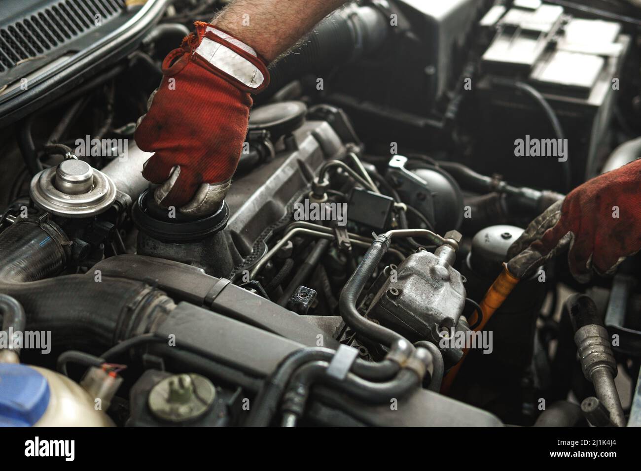 Man hands inspecting car engine hi-res stock photography and images - Alamy