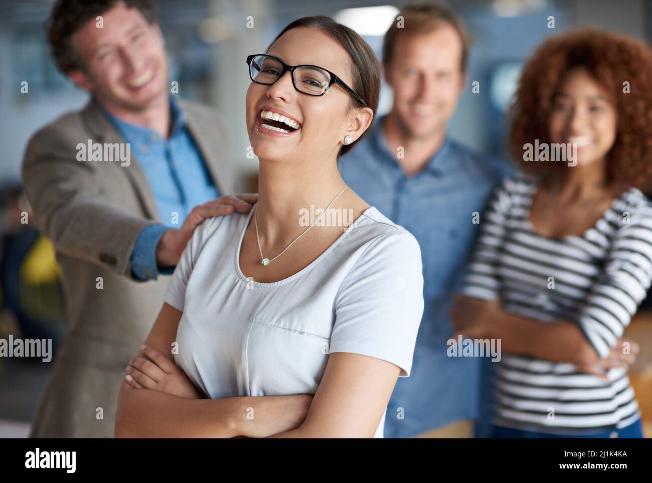 Lifes great with the support of my colleagues. Young businesswoman ...