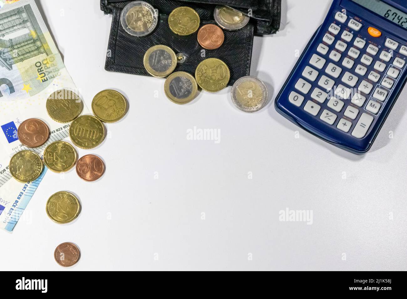 European money with black wallet on white desk as white background with ...