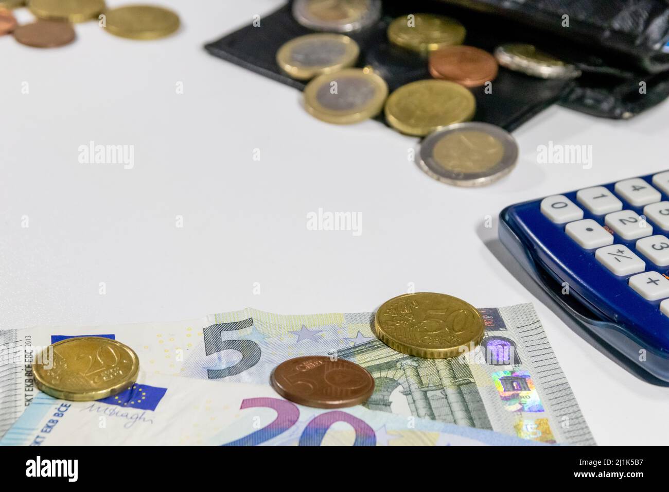 European money with black wallet on white desk as white background with ...