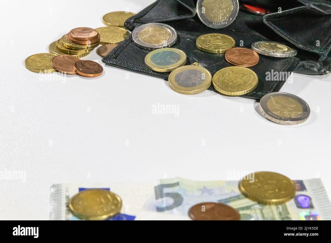 European money with black wallet on white desk as white background with ...