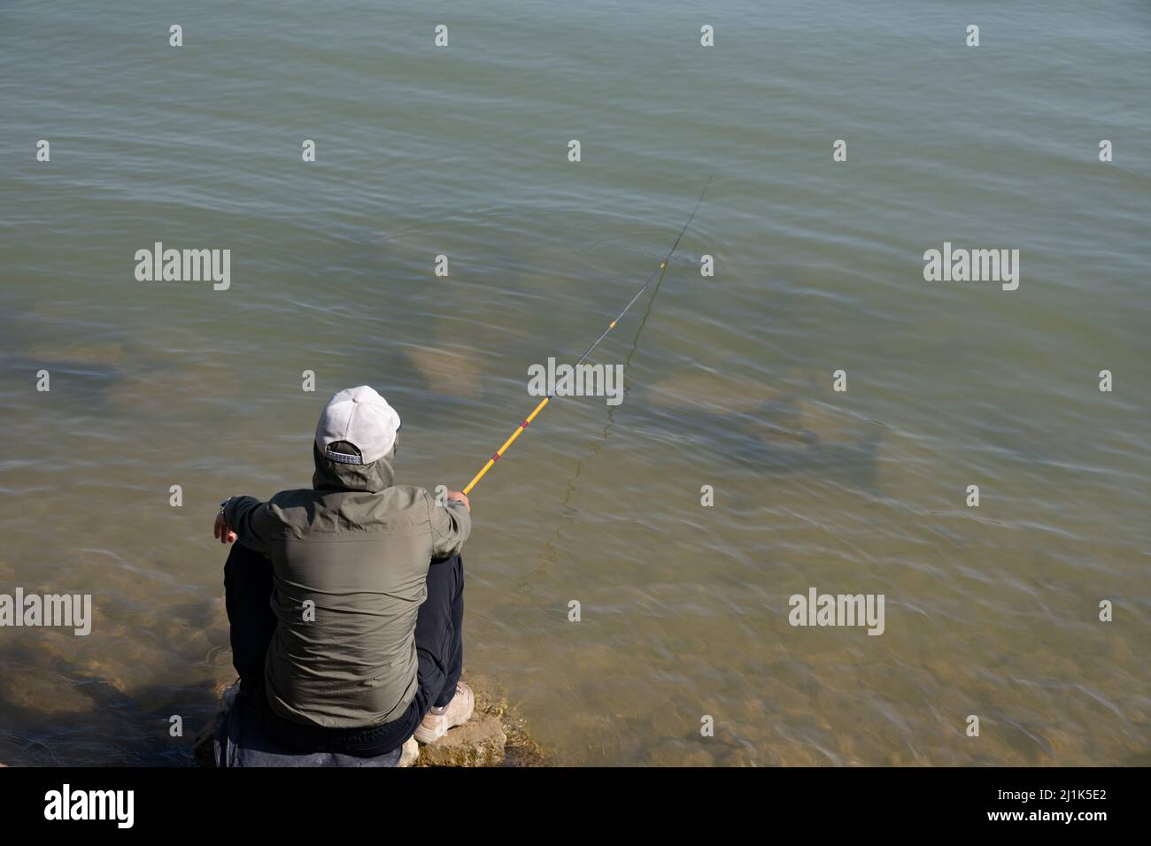 Woman fishing on spinning hi-res stock photography and images - Alamy