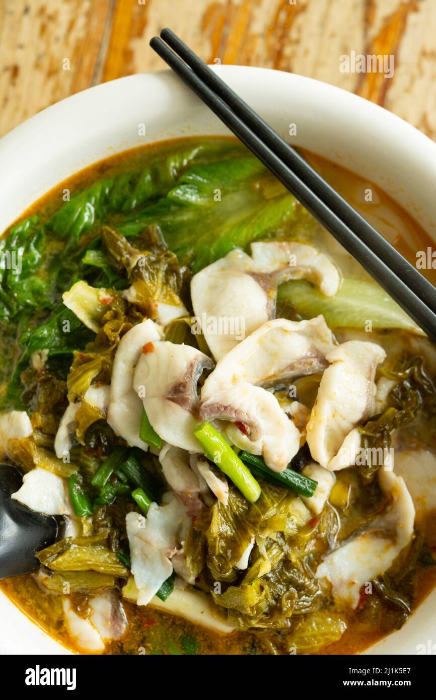top view spicy boiled fish with rice noodles vertical composition Stock ...