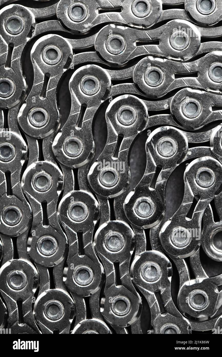 Patterns of a technological bicycle chain braided in a circle with blue ...